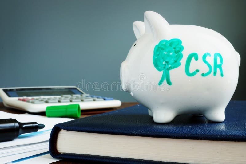 Corporate Social Responsibility CSR. Piggy Bank and Documents Stock ...