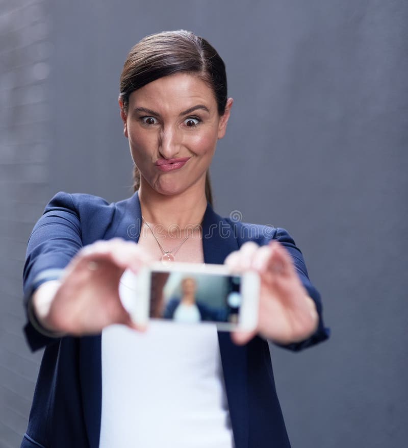 Corporate Woman Selfie And Cellphone By Dark Background For Happiness