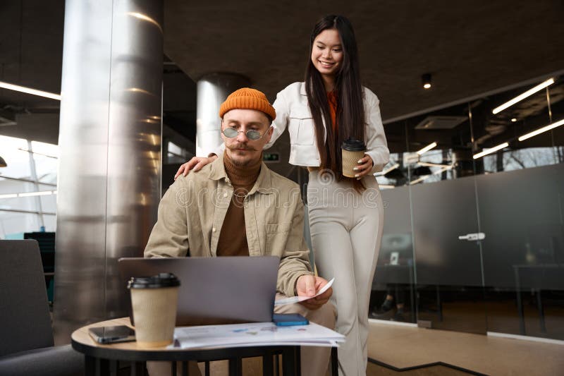 Corporate Worker Working on Portable Computer Supervised by Office ...