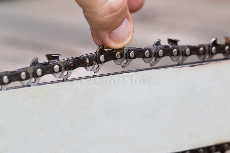 Correct Chain Tension Using the Special Tool on the Chainsaw Bar. Chain ...