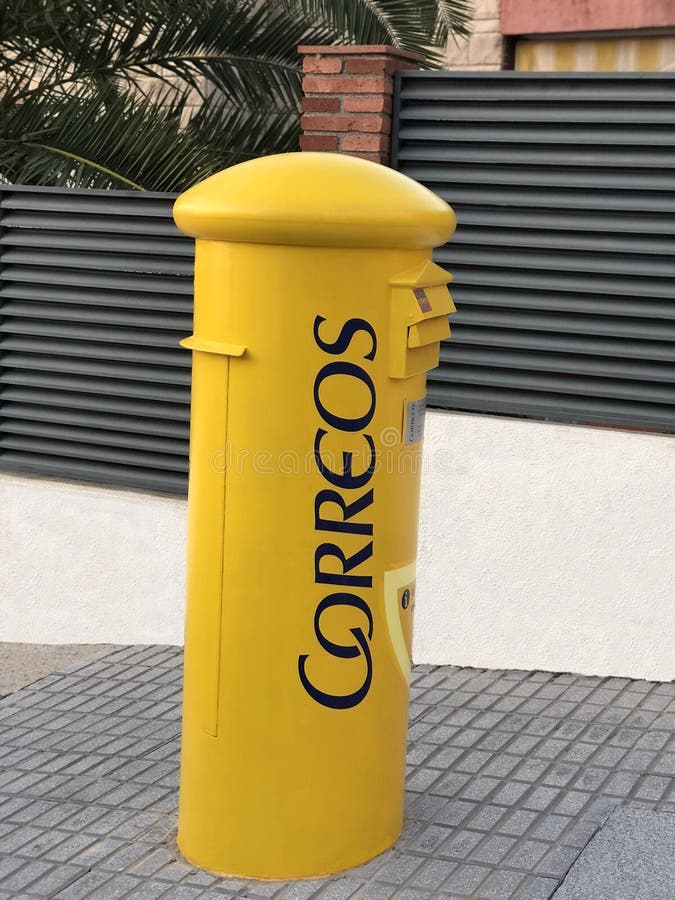Spanish Postbox Mounted in a Yellow Painted Wall Stock Image - Image of ...