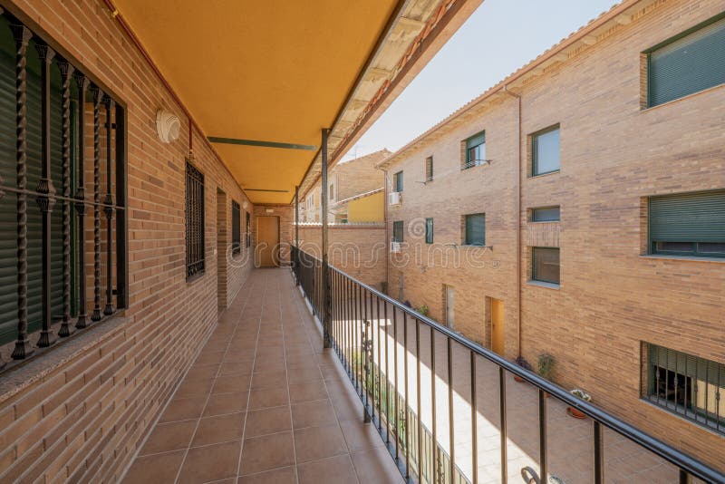 Corridor of a Building with Access Corral To Several Houses and an ...