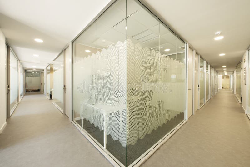 Corridor of a Coworking Office Floor with Cubicles Separated by Glass ...