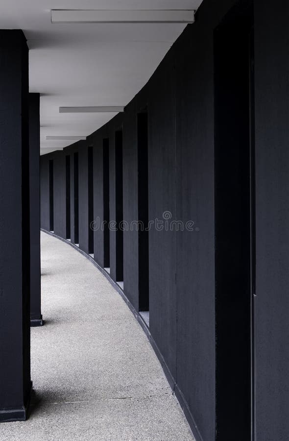 Black columns in a hallway stock photo. Image of design - 228227832