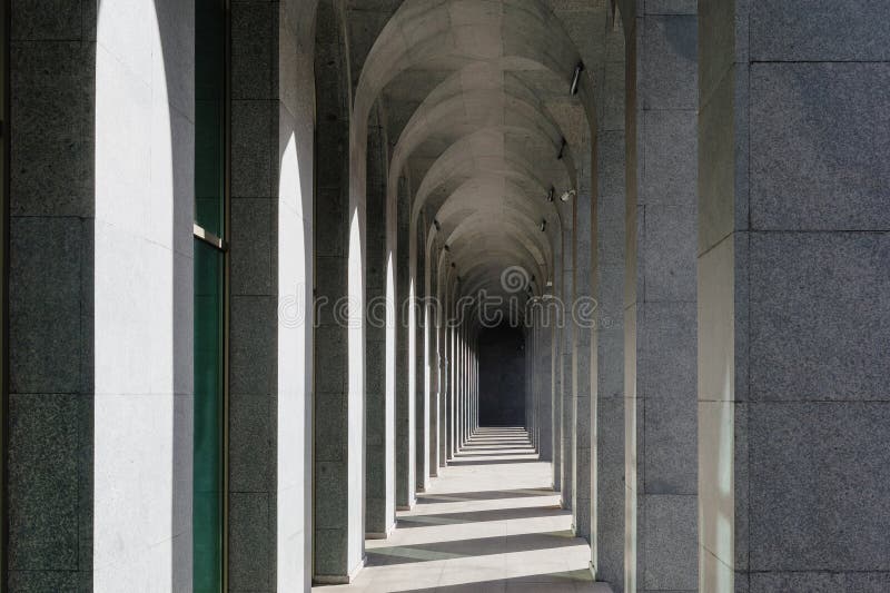 Corridor with Rows of Columns in Sunlight Stock Image - Image of ...