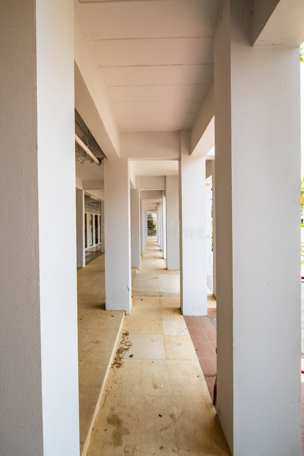 Corridor Under the Building Stock Image - Image of door, building ...