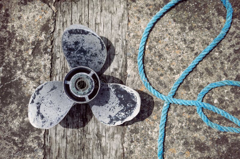 Corroded Boat Propeller and Rope Stock Photo - Image of industrial ...