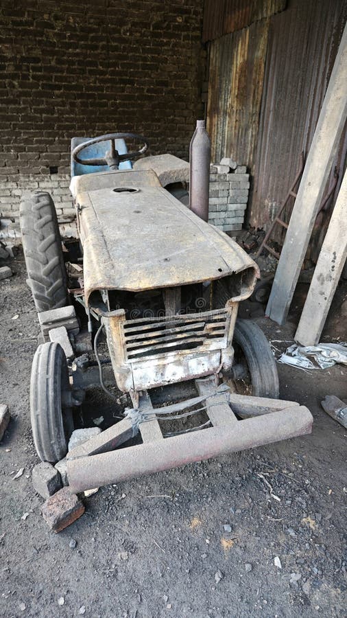 Corroded Rusty Tractor Abandoned in the Garage. Stock Image - Image of ...