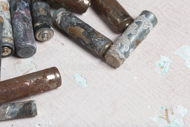 Corroded Used Batteries. they Lie on a Light Surface Stock Photo ...