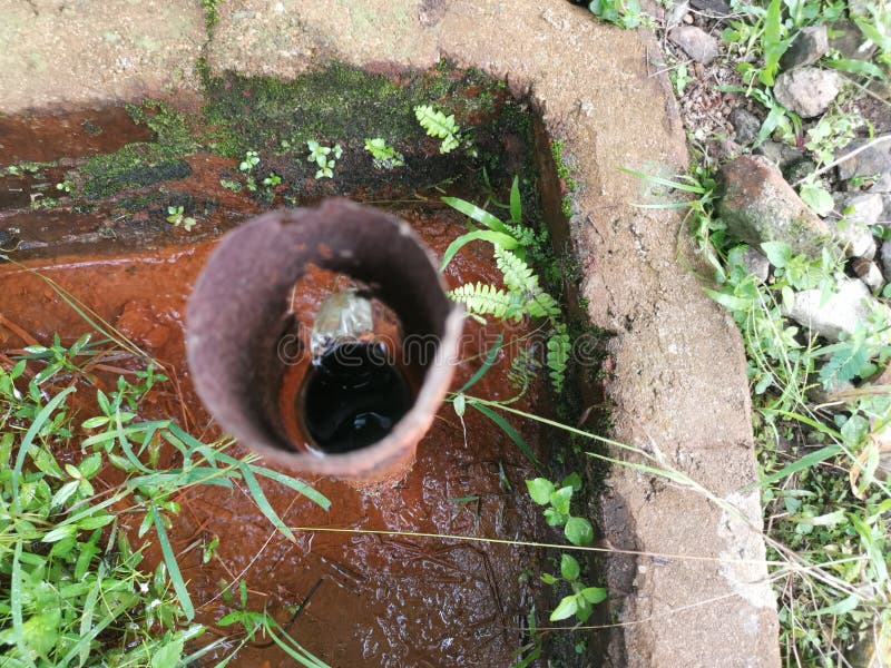 Corroded Water Pipe Leaking in the Farm Meadow. Stock Image - Image of ...