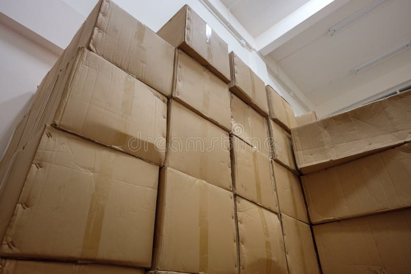 Corrugated Cardboard Storage Boxes Stacked in Warehouse Stock Photo ...