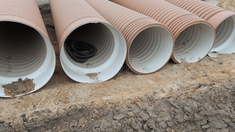 Corrugated Double-Walled Polypropylene Pipes Lined Up at a Construction ...