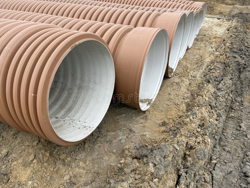 Corrugated Double-Walled Polypropylene Pipes Lined Up at a Construction ...