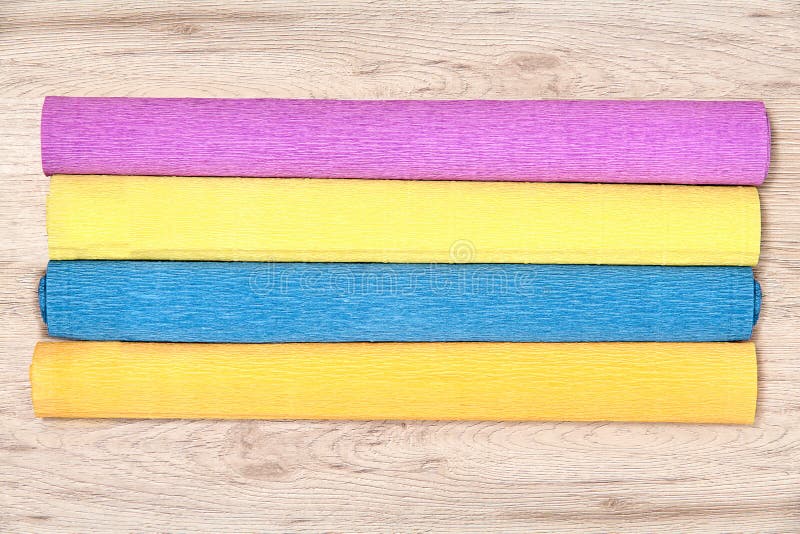 Four Different Colored Crepe Paper Rolls are on Board. Stock Photo ...