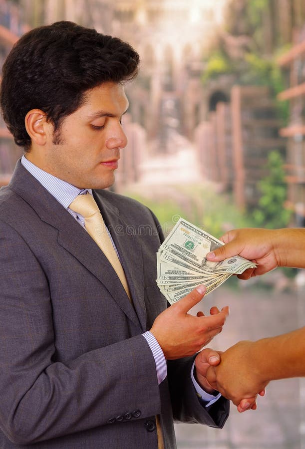 Corrupted Young Businessman Accepting Some Money from a Crook Stock ...