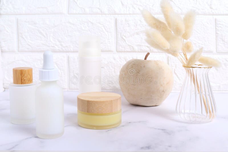 Cosmetic Bottles on Table, Lifestyle Setting with Shadows Stock Photo ...