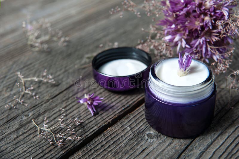 Cosmetic Face Cream Bottle and Violet Flower Stock Photo - Image of ...