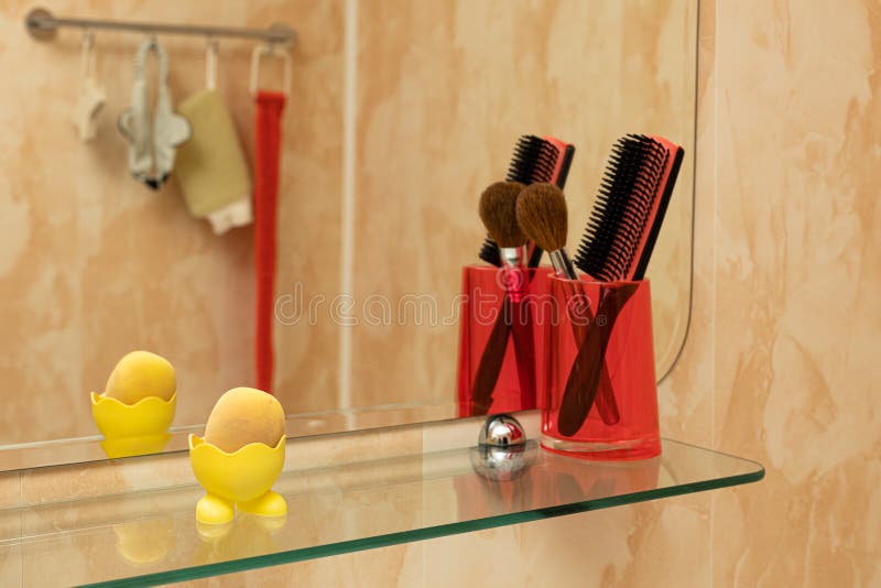 Cosmetic Sponge in the Form of an Egg Stands on the Mirror in the ...