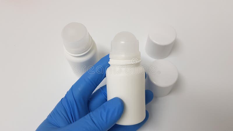Cosmetic Technician Showing a Deodorant and Antiperspirant Rollon ...