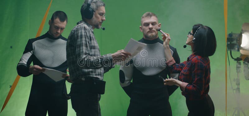 Cosmetician Preparing an Actor while Others Discussing Stock Photo ...