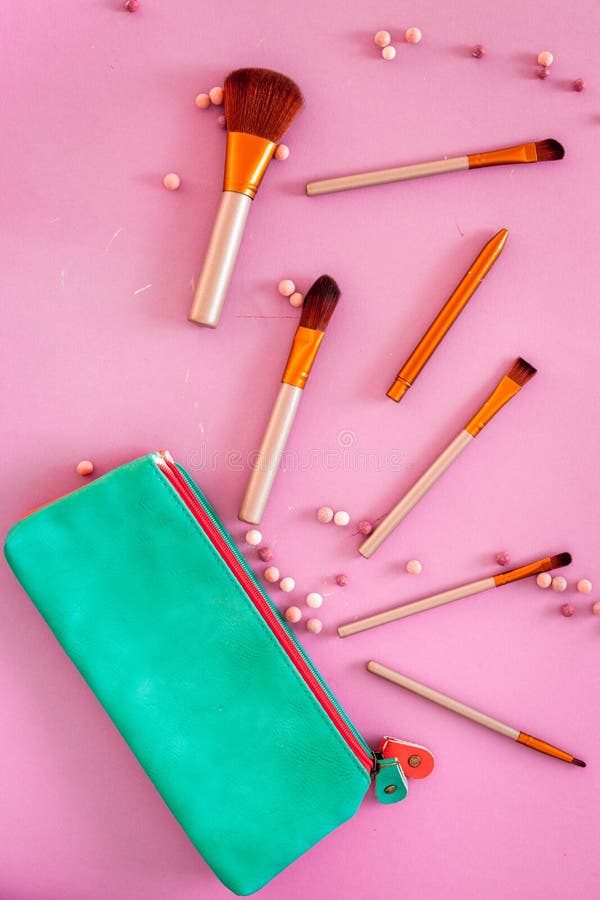 Cosmetics on Colorful Background. Set of Brushes for Makeup on Pink ...
