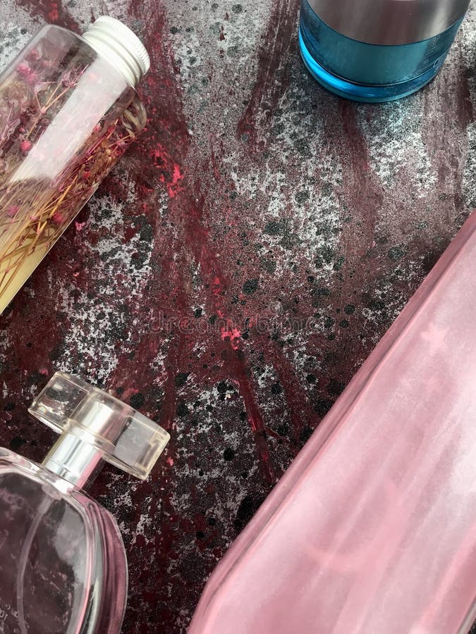 Cosmetics in Pink Color on an Abstract Dark Background Stock Image ...