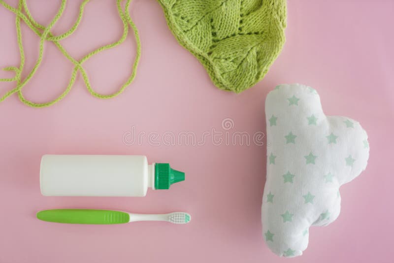 Cosmetics with Toothbrush, Knitted Hat and Toy on Color Background ...