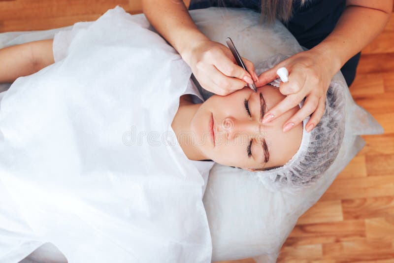 Cosmetolog Beauty Master Making Marks with Pencil before the Permanent ...