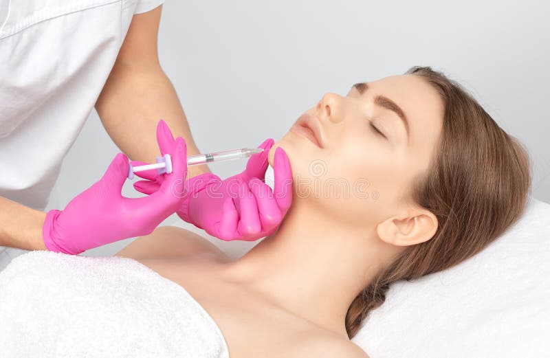 Cosmetologist Makes Rejuvenating Anti Wrinkle Injections On The Face Of