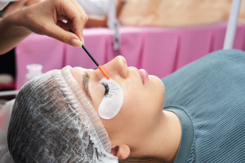 Cosmetologist Making Eyelash Extention and Correction Using Brush Stock ...