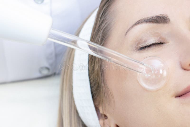 Cosmetologist Performs a Pulse Current Procedure Stock Photo - Image of ...
