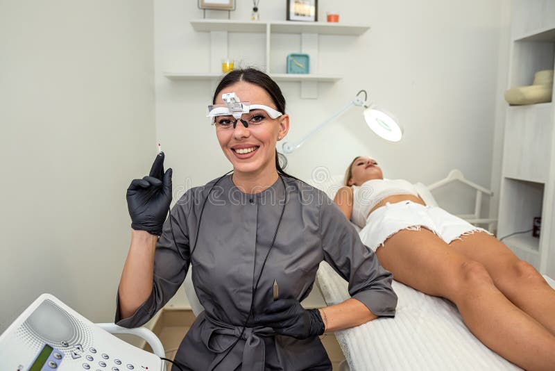 Cosmetologist Prepares Everything for the Electroepilation Procedure ...