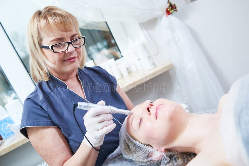 Cosmetology Female Facial Skin Beauty Procedure In Salon Stock Image