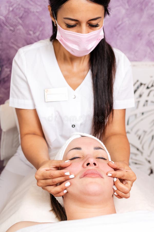 Cosmetology A Professional Cosmetologist In A Medical Mask Makes A