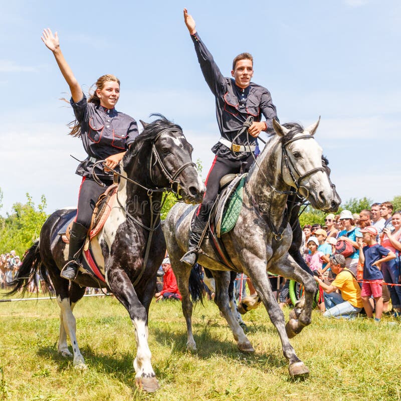 Cossack and Cossacks on Horseback Jump Over the Barrier Editorial Image ...