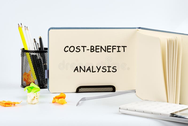 Cost Benefit Analysis Tools on a Desk with Stationery and Notes for ...