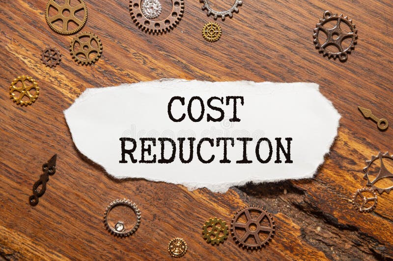 COST REDUCTION is Written on a White Tablet Held by a Man. Stock Image ...