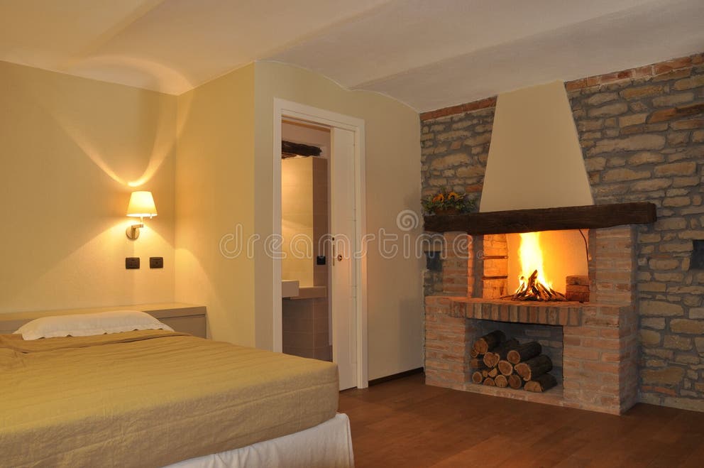 Cosy fire in bedroom stock photo. Image of house, stone - 10951690