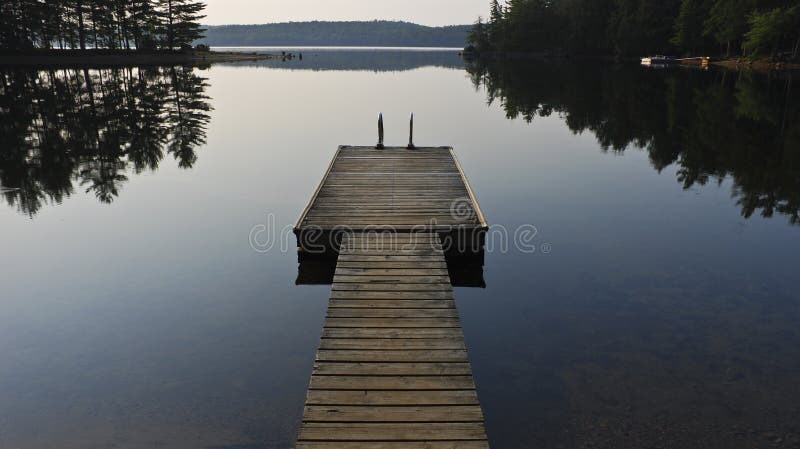 Cottage Dock on Lake stock image. Image of relaxation - 20184363