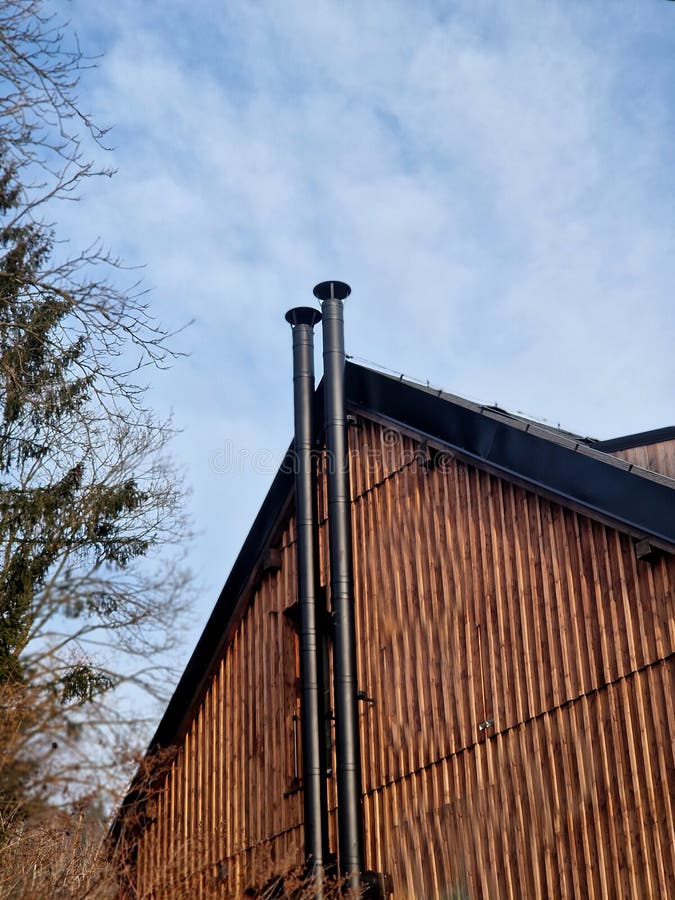 Cottage with Exposed Chimneys on the Facade, Plank Cladding Stock Image ...