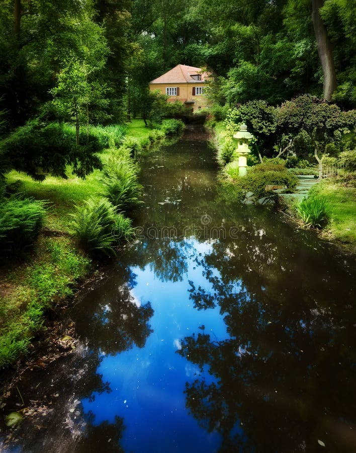 Cottage hidden in the park stock photo. Image of garden - 16021526