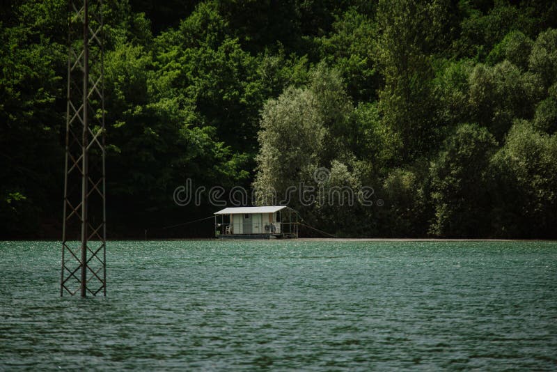 Cottage on the Lakeside with Forest S Trees in the Background Stock ...