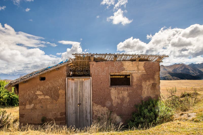 Cottage with Matted Roof in the Middle of a Grass-covered Field Under ...