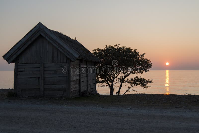 Cottage by the Ocean in Sunset Stock Image - Image of cottage ...