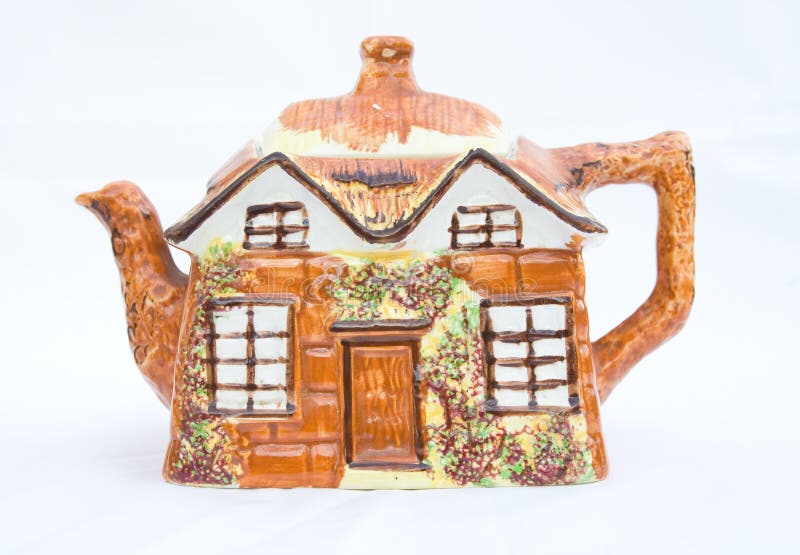 Cottage style teapot. stock image. Image of thatched - 11247345