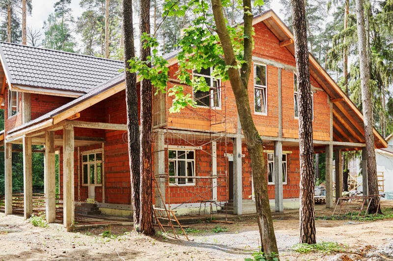 Cottage Under Construction among Trees in the Stock Photo - Image of ...