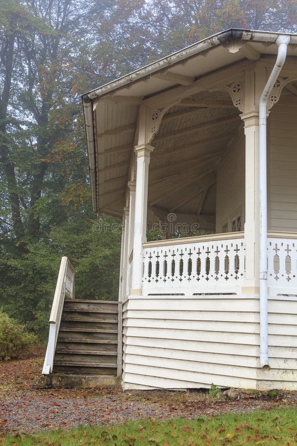 Cottage with a veranda stock photo. Image of park, leaf - 26629562