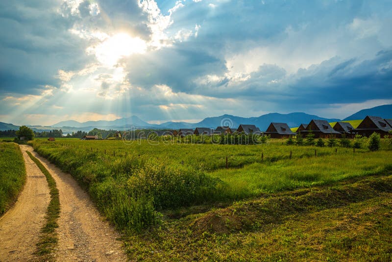 Cottages in the Field Under the Beautiful Sky and the Ray of the Sun ...