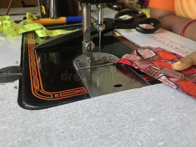 Cotton Clothes are Under Stitching Process by an Indian Working Lady ...
