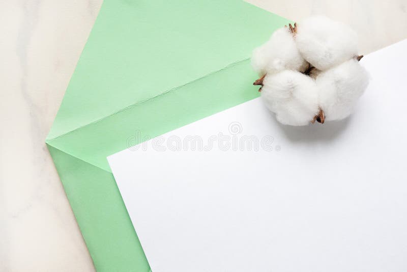 Cotton Flower and Green Envelope and White Paper Stock Image - Image of ...